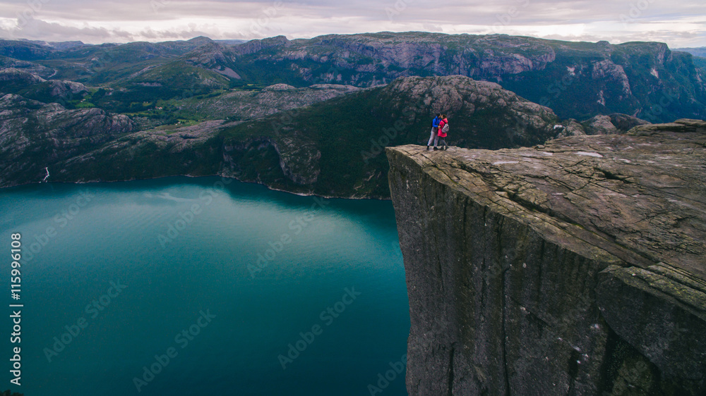 couple in love Preikestolen massive cliff (Norway, Lysefjorden s Stock ...