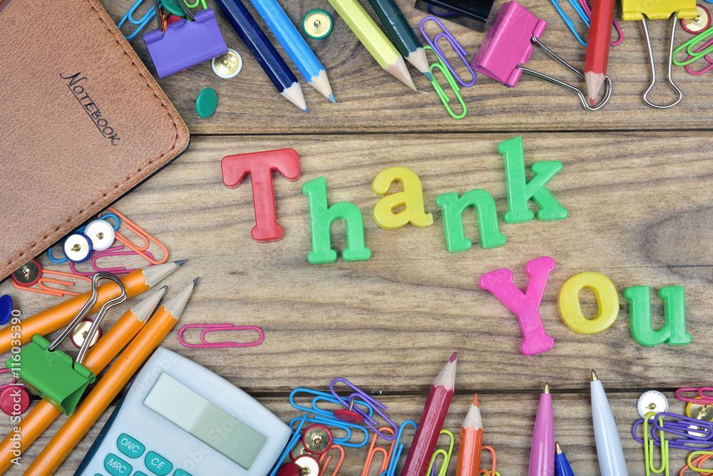 Thank You word and office tools on wooden table Stock Photo | Adobe Stock