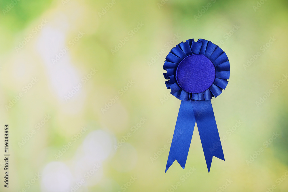 Blue award prize ribbon on blurred background Stock Photo | Adobe Stock