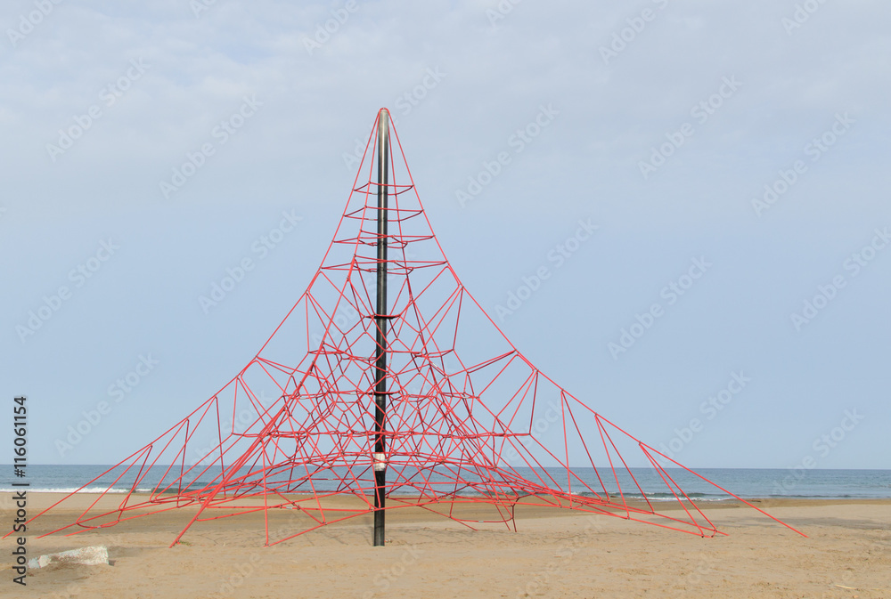 rope pyramid for children to play on a beach in the Mediterranea Stock ...