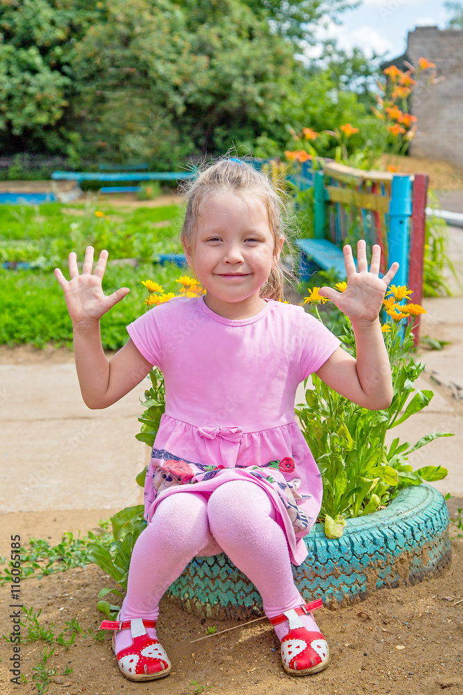 Portrait of a happy little girl raising her hands up Stock Photo ...