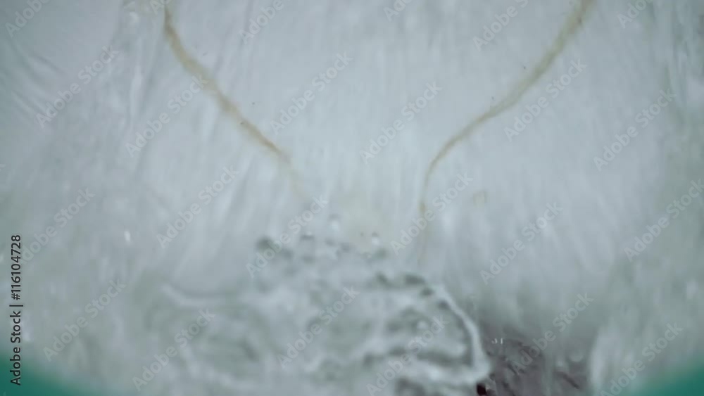 Flush old, untidy wc, water splash in toilet with green seat. Slow ...