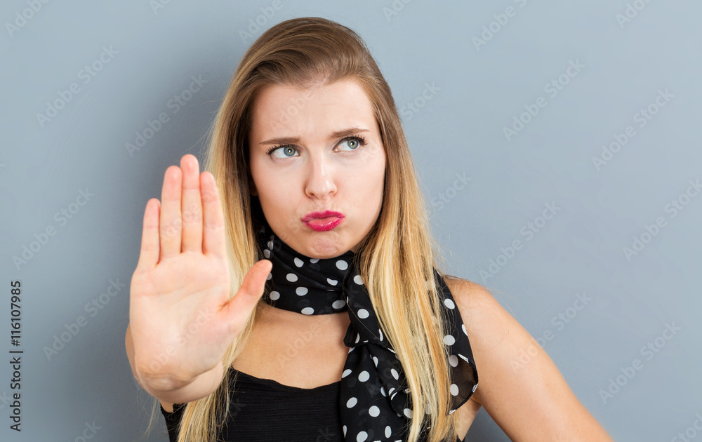 Young woman making a rejection pose 스톡 사진 | Adobe Stock