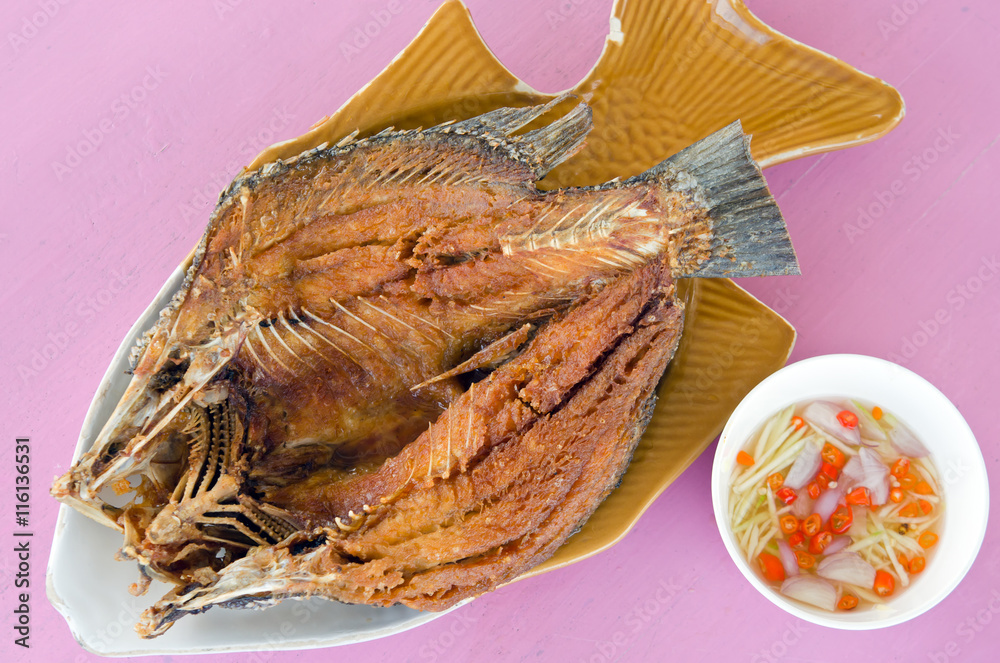 Fried striped bass fish with fish and oyster sauce Stock Photo | Adobe ...