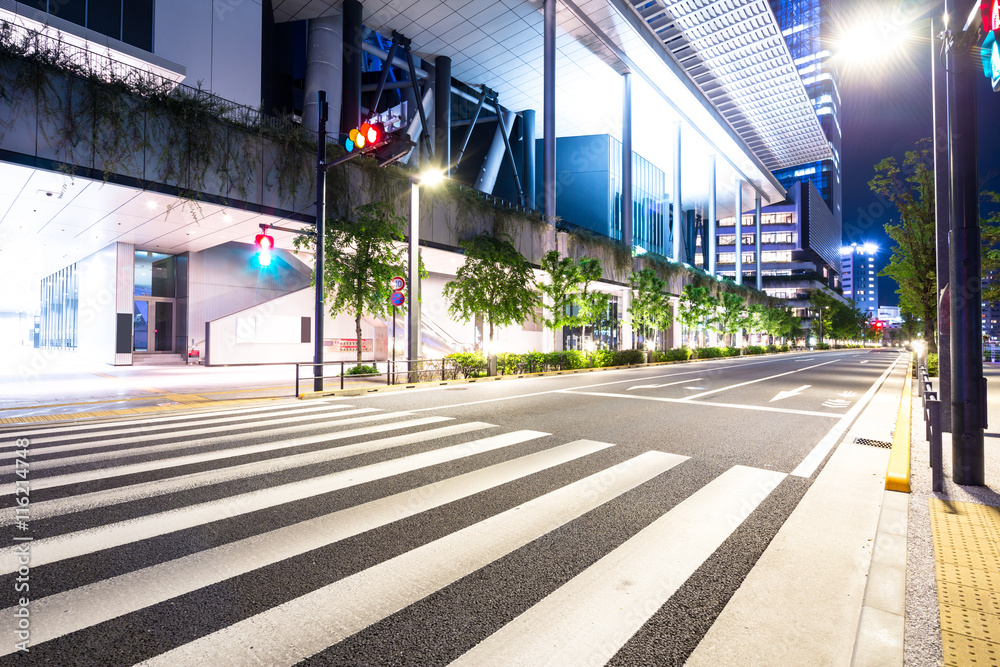 traffic on road intersection in downtown of tokyo at night Stock Photo ...