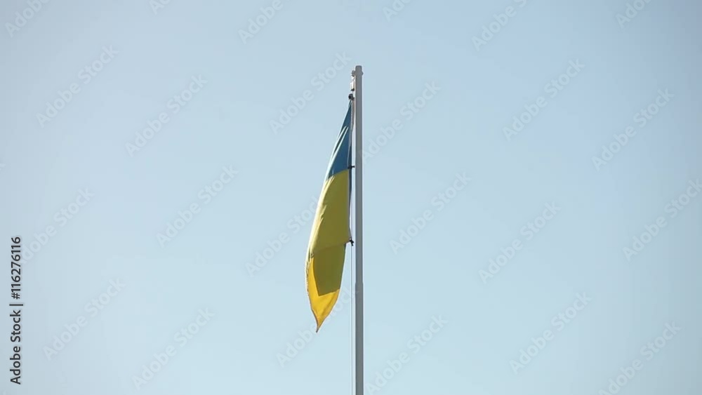 Ukrainian flag on flagpole, closeup. Symbol of Ukraine. Flag flies on ...