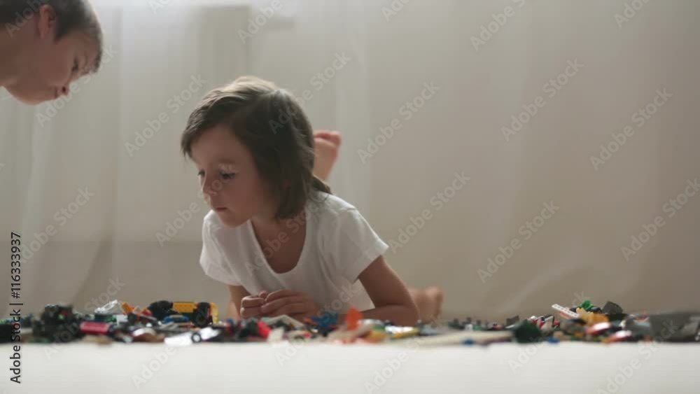 Cute little preschool children, boy brothers, playing at home with ...