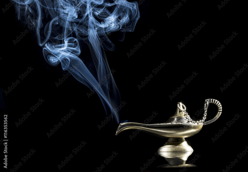 Magic lamp on black background from the story of Aladdin with Genie appearing in blue smoke ...