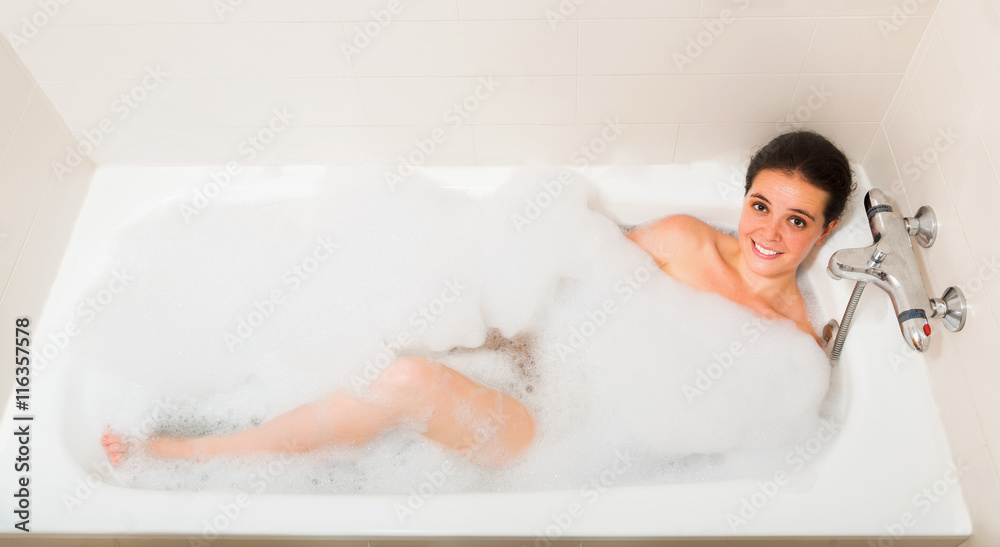 Girl with foam in bath Stock Photo | Adobe Stock
