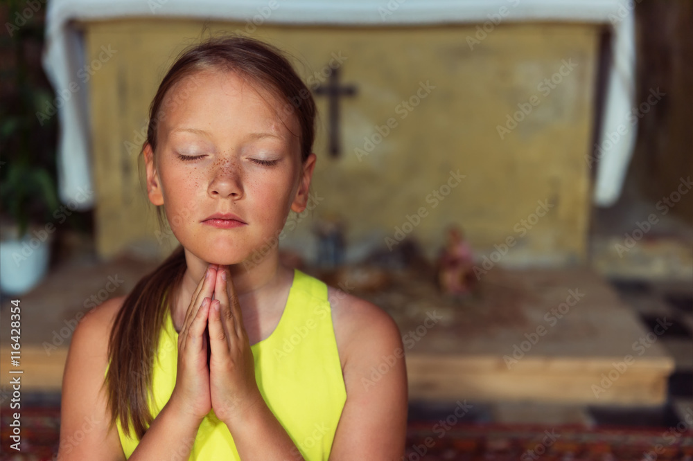 Child praying in church Stock Photo | Adobe Stock