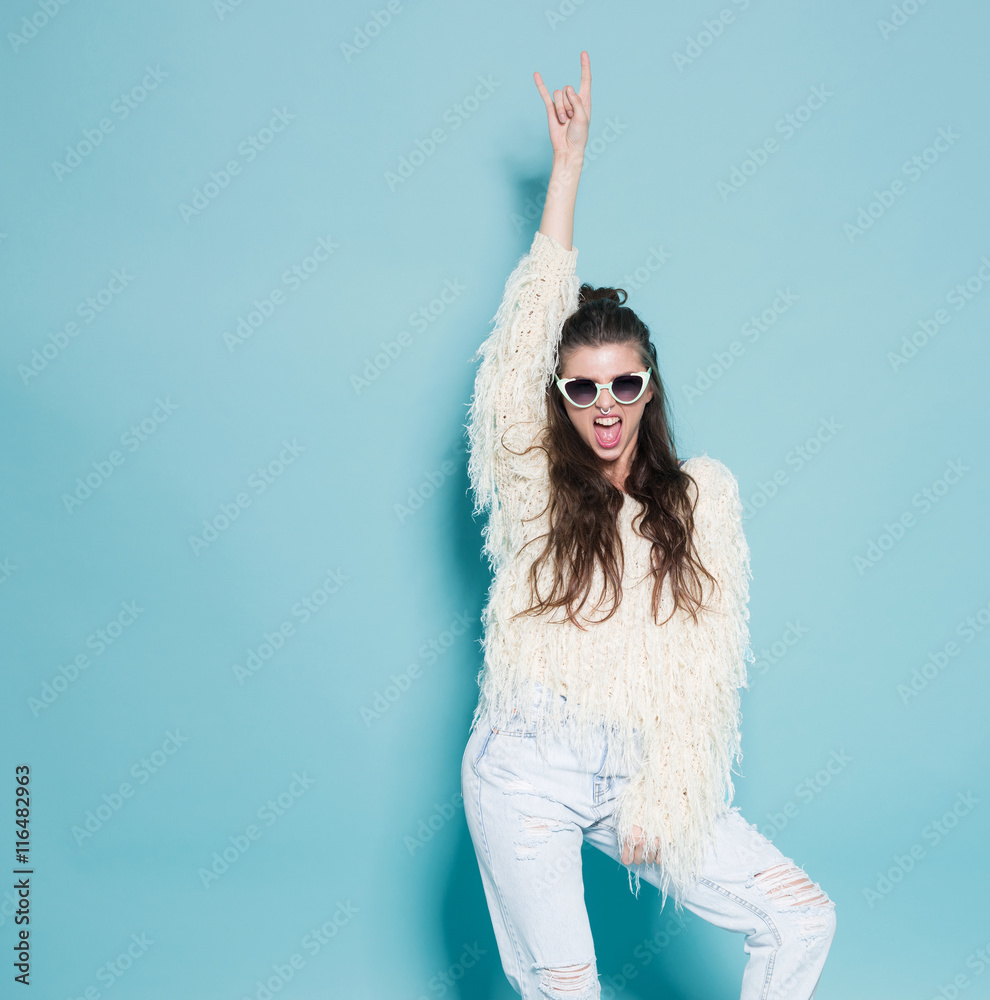 portrait of cheerful fashion hipster girl going crazy making funny face ...