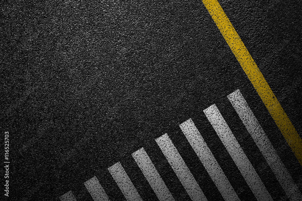 Level asphalted road with a dividing stripes and pedestrian crossing ...