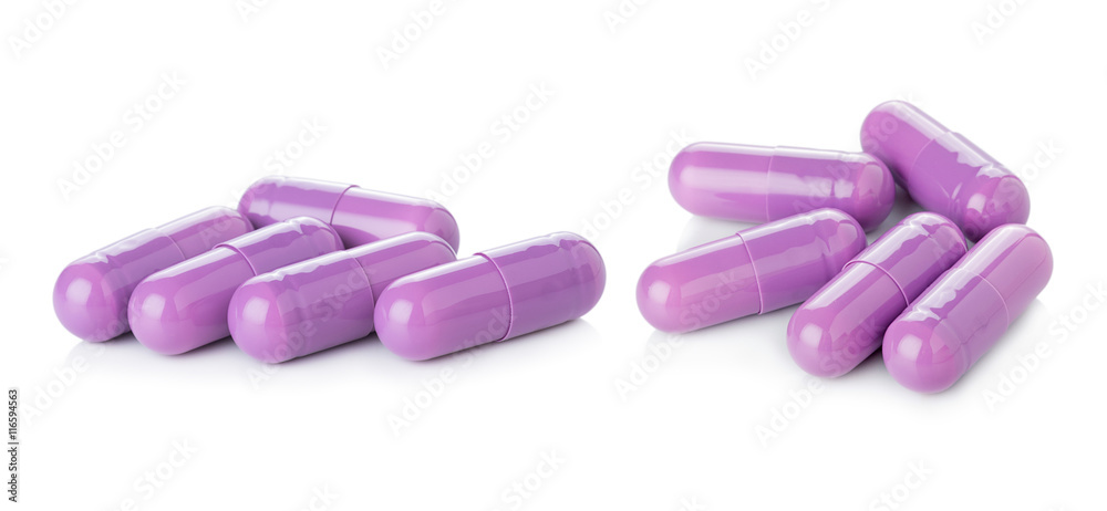 Purple pill capsules on white background Stock Photo | Adobe Stock