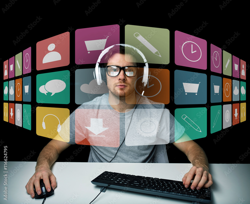 man in headset with computer and icons on screen Stock Photo | Adobe Stock