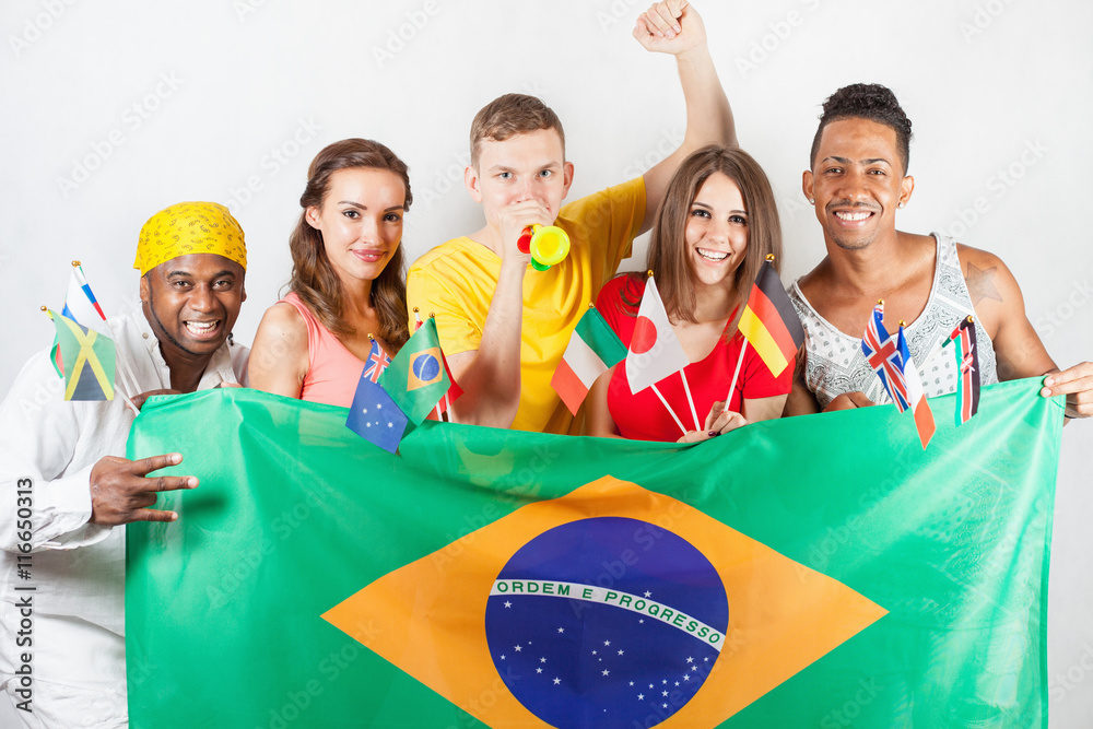 Group multiracial people holding a Brazil flag and international flags ...