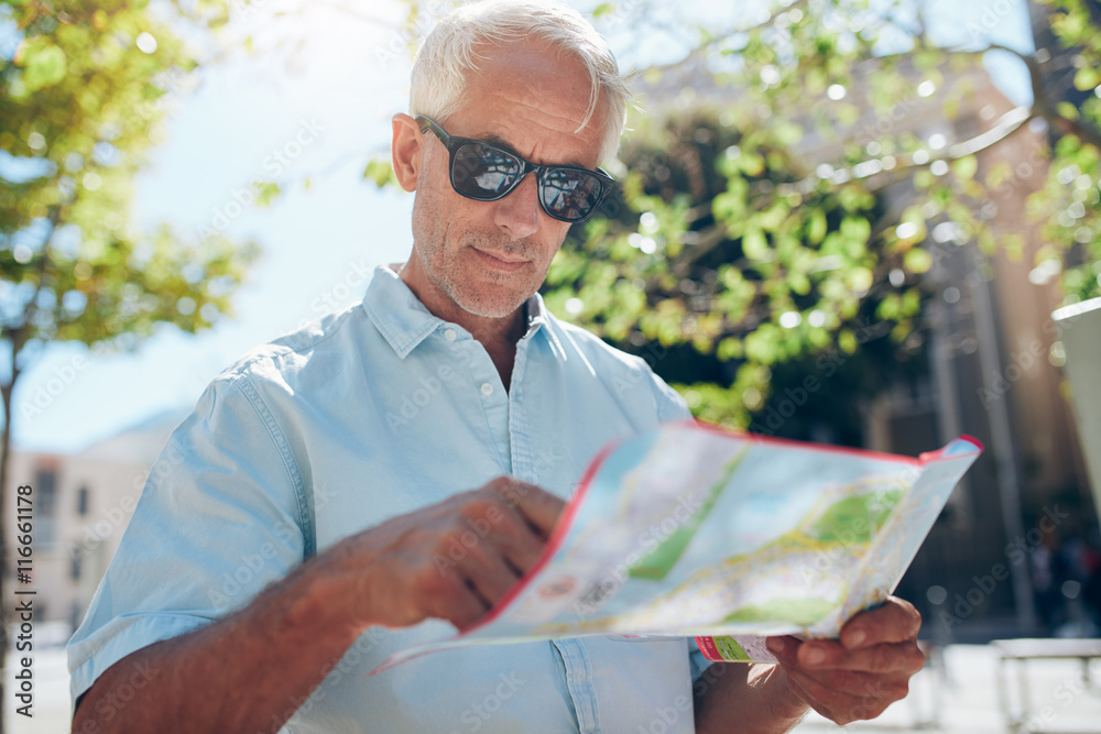 Tourist with a map in city Stock Photo | Adobe Stock