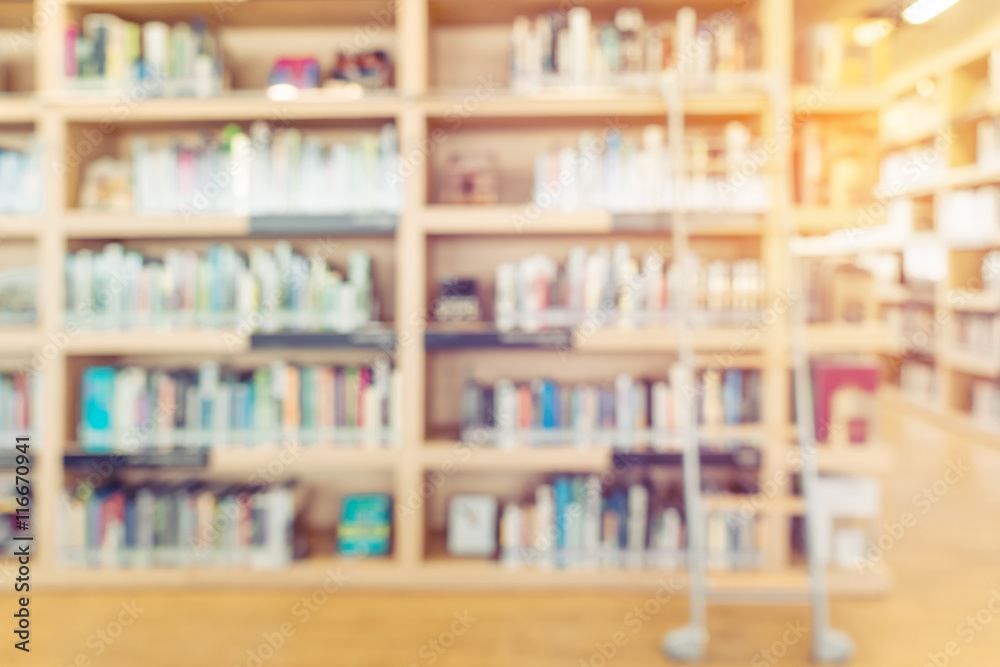 blurred bookshelf in library room for your background design - vintage ...
