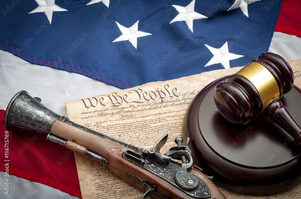 American flag, US constitution, a gavel and and musket type pistol ...