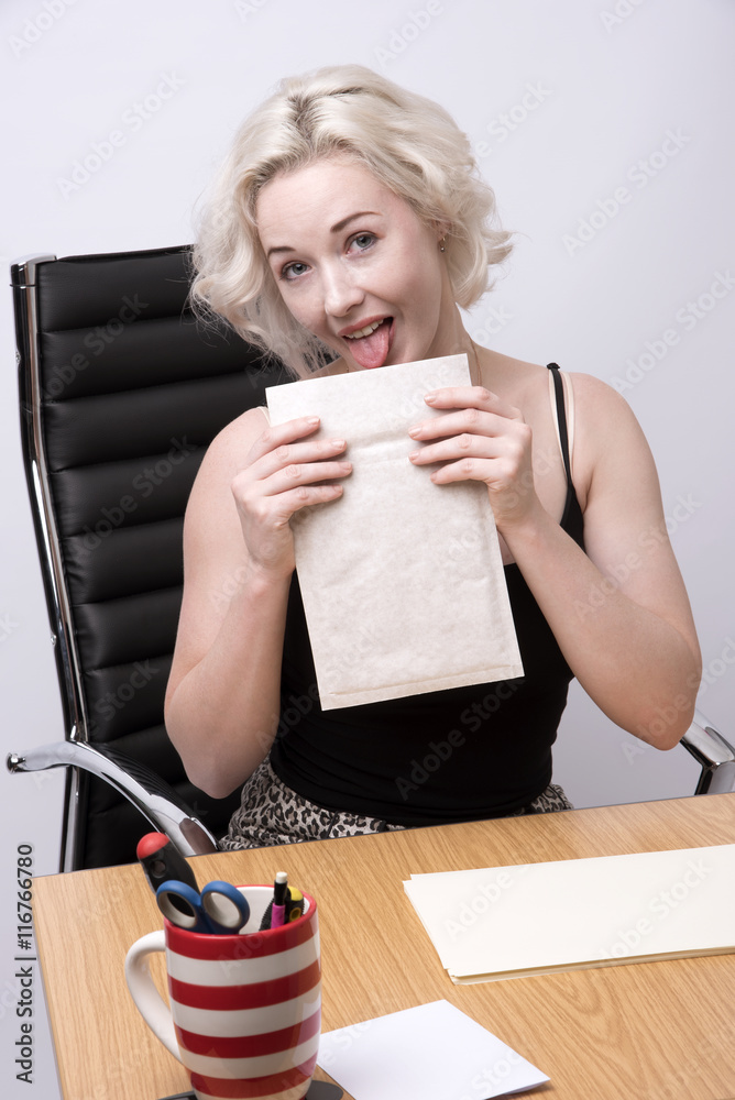 SECRETARY WORKING AT A DESK - JULY 2016 - Secretary licking an envelope ...