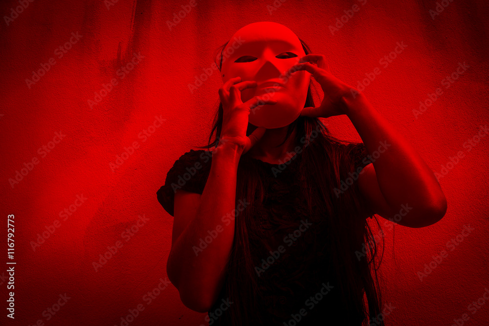 Mysterious woman in black dress wearing white mask,Scary background for ...