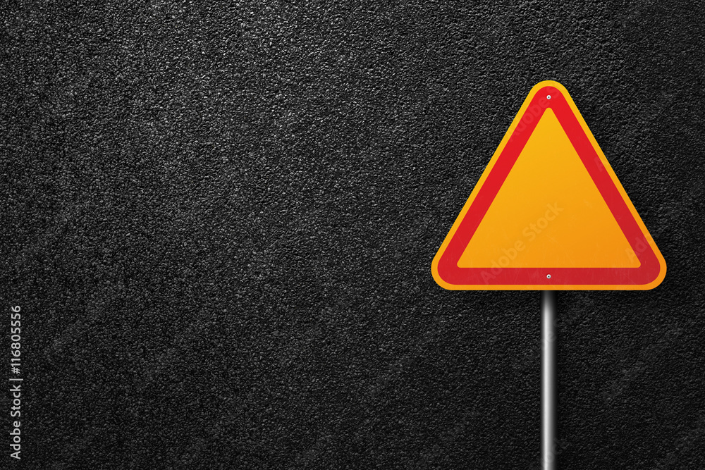 Road signs of the triangular shape on a background of asphalt. The ...