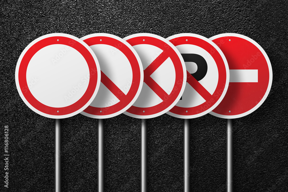 Road signs of the circular shape are placed in a row on a background of ...