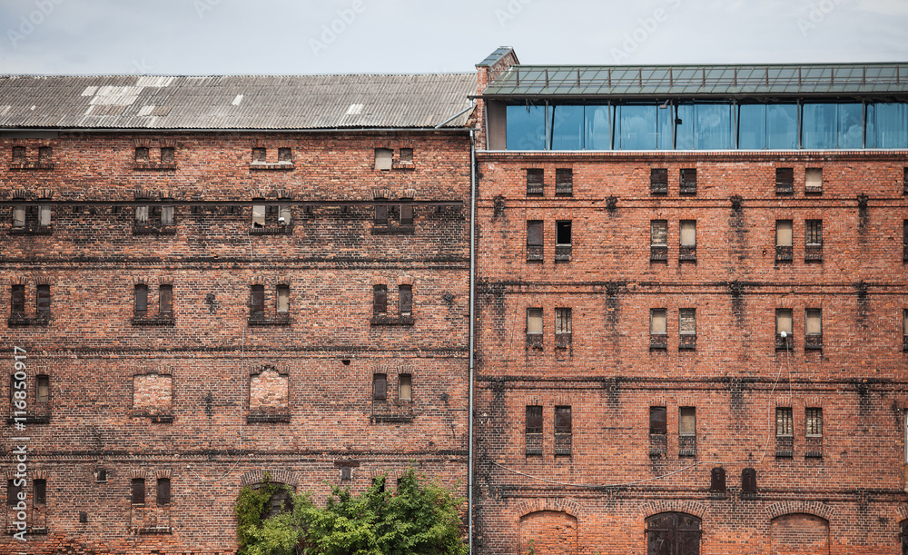 wall of the old factory building of red brick with narrow windows Stock ...