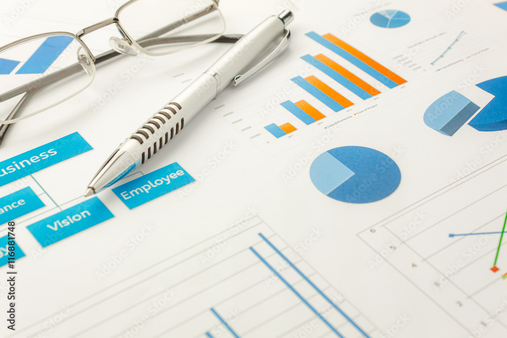 business background grown up concept the pen and eyeglasses on chart ...