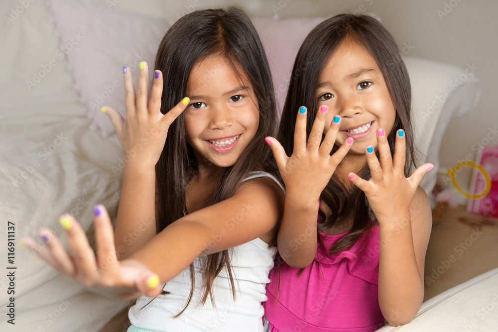Little girls with painted nails. Stock Photo | Adobe Stock