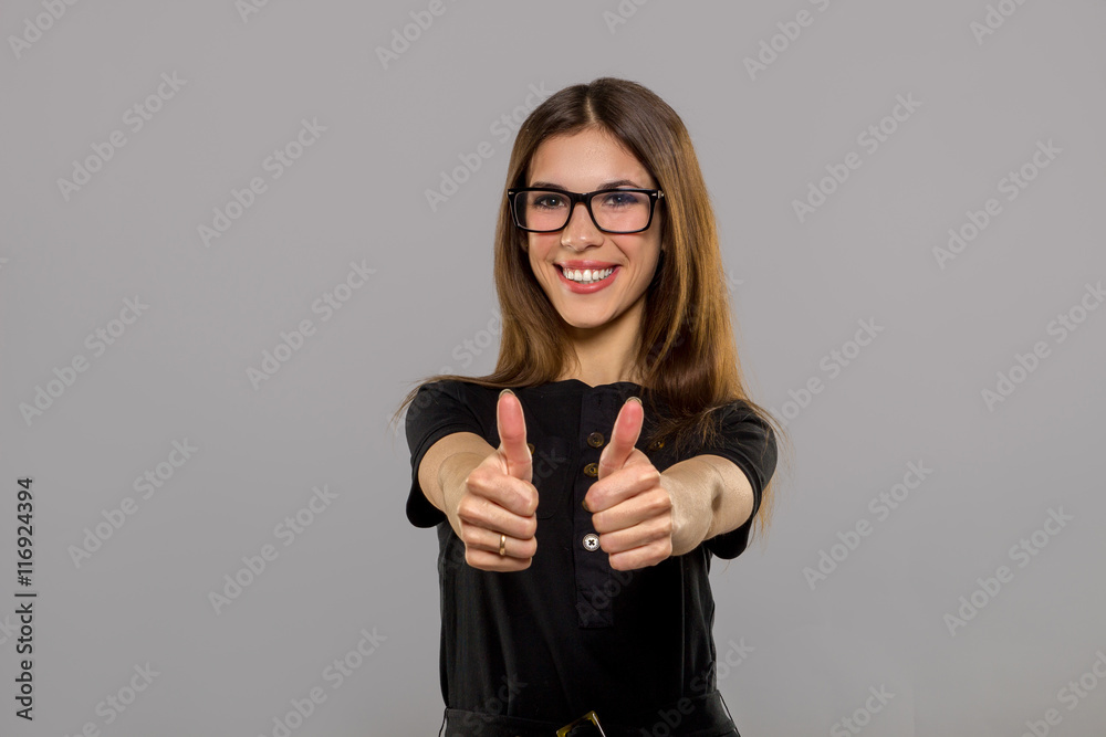 Girl shows thumbs up Stock Photo | Adobe Stock