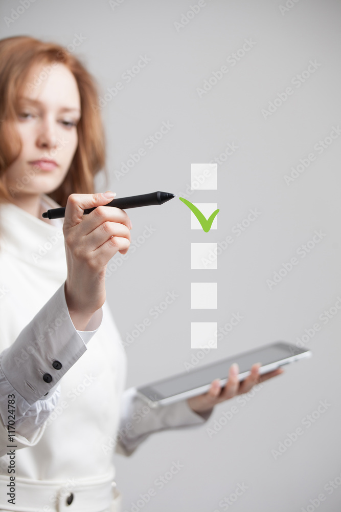 Young business woman checking on checklist box. Gray background. Stock ...
