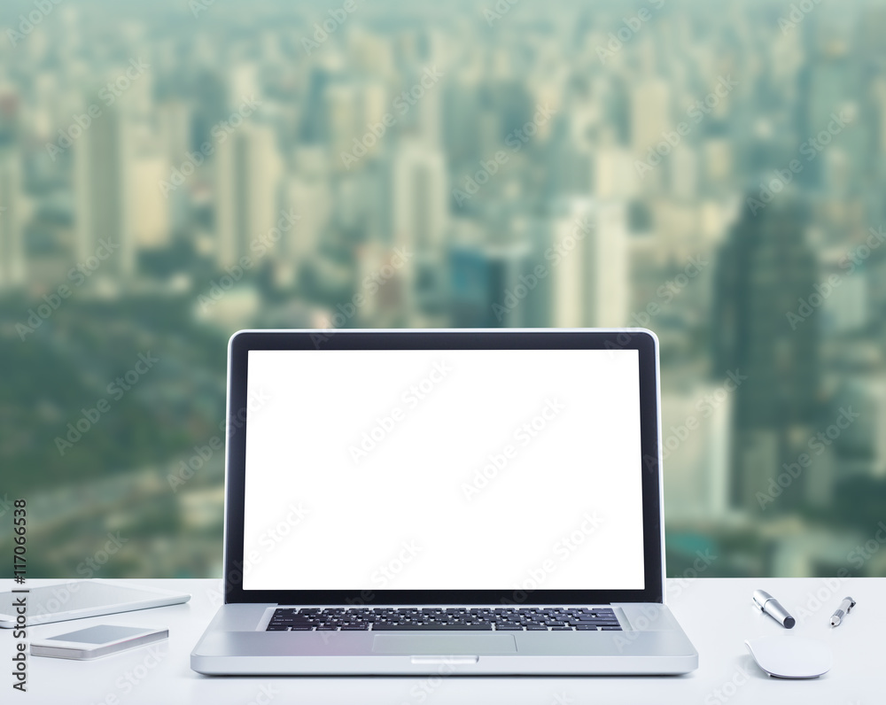Laptop computer on office table with skyline background Stock Photo ...