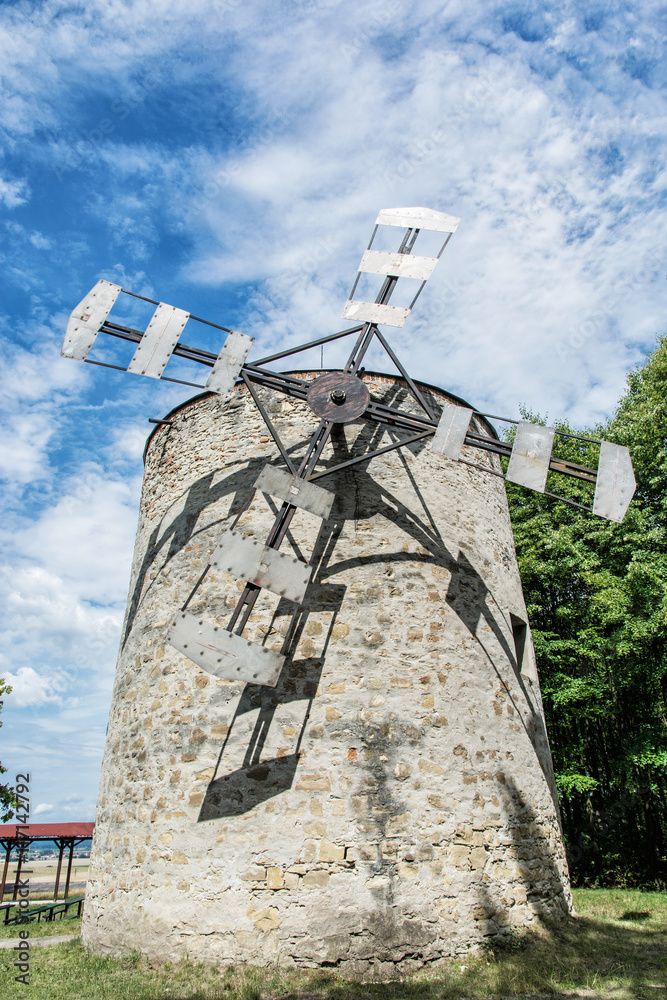 Foto de Old tower windmill in Holic, Slovakia, vertical composition do ...
