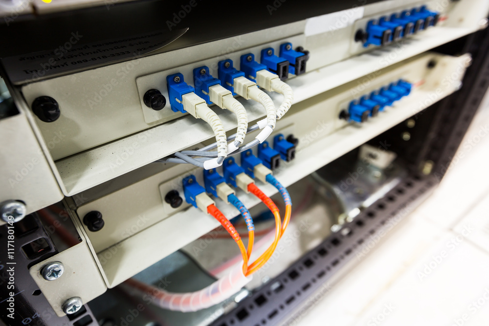 Fiber optic cable connect to ethernet switch mount on rack. Stock Photo ...