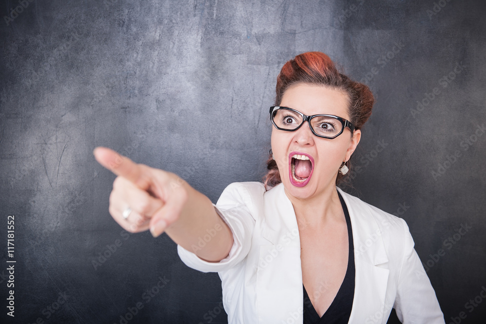 Angry screaming teacher pointing out on blackboard background Stock ...
