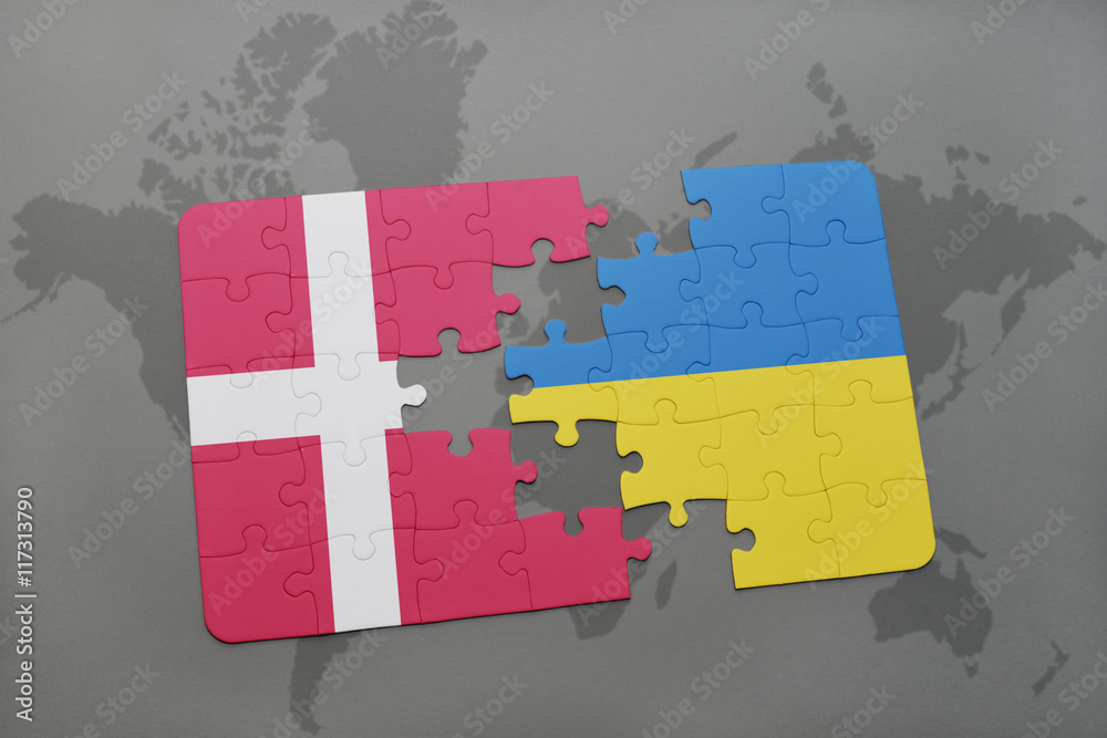 puzzle with the national flag of denmark and ukraine on a world map ...