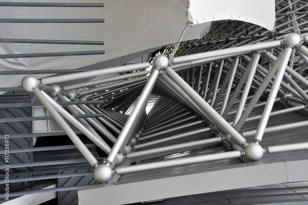 Metal spatial triangular structure close-up. The rods combined in ball ...