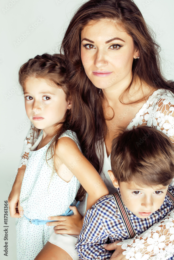 young mother with two children on white, happy smiling family inside ...