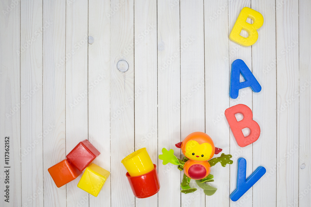Baby toys on a white rustic background with copy space Stock Photo ...