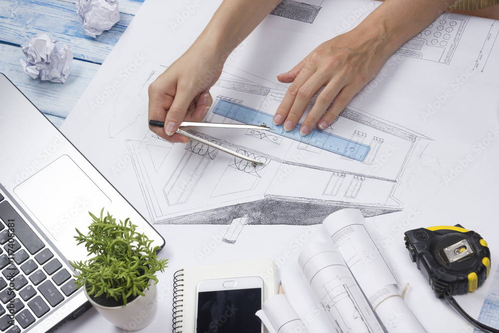 Architect working on blueprint. Architects workplace - architectural ...