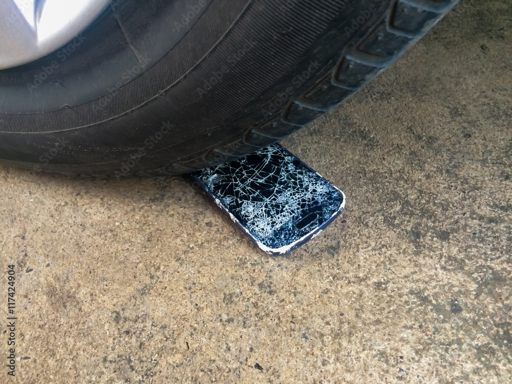 Accident with your mobile phone.cellphone crashed by car.Smart phone ...