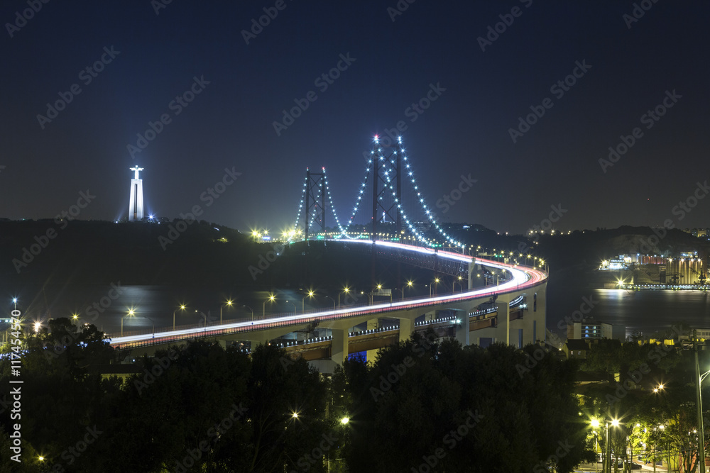 Night view of Ponte 25 de Abril, one of the largest suspension bridges ...