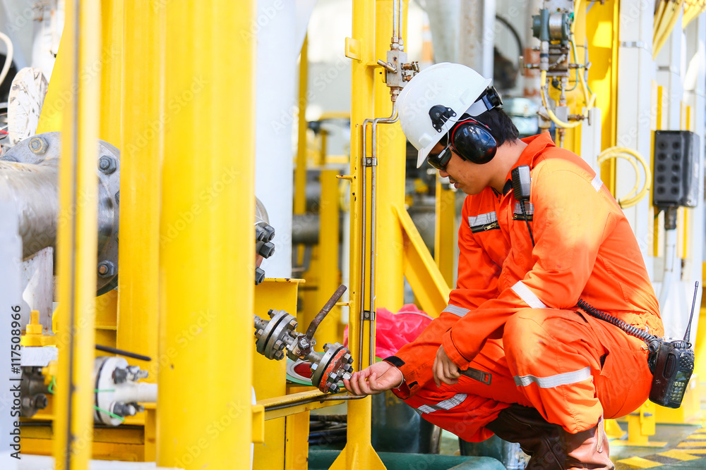 operator recording operation of oil and gas process at oil and rig ...