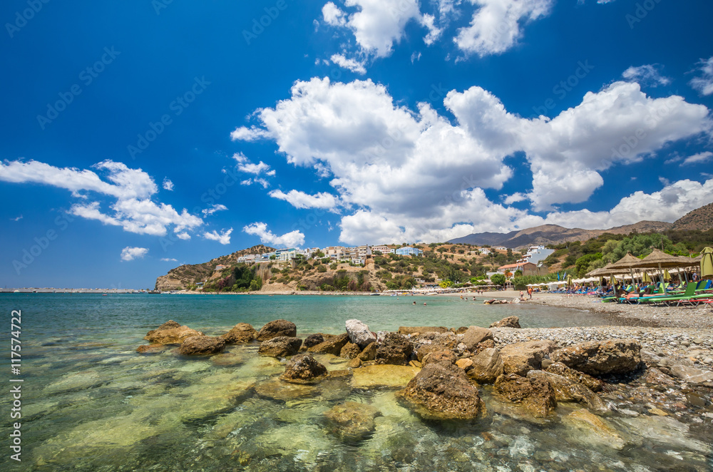 Agia Galini Beach in Crete island, Greece. Tourists relax and bath in ...