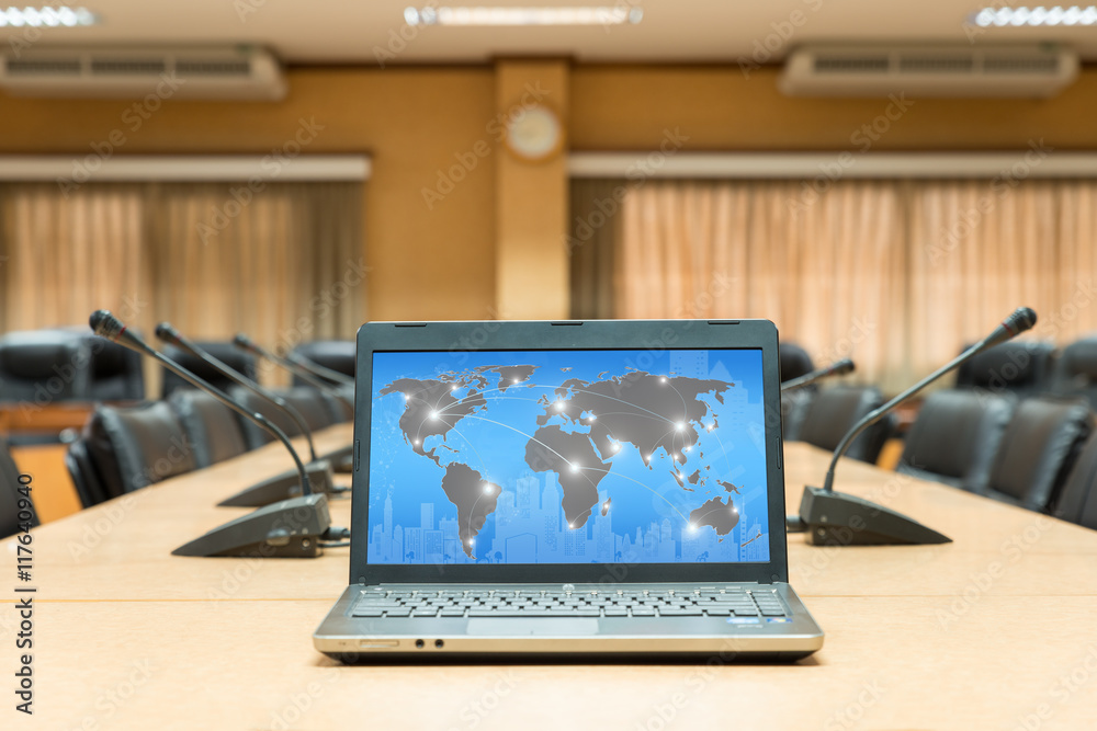Laptop in front of business meeting room showing connection map. Stock ...