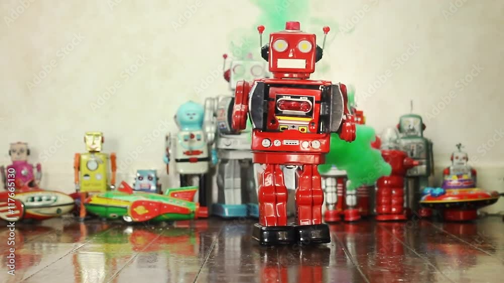 retro red robot toy walks into frame with green smoke Stock ビデオ | Adobe ...