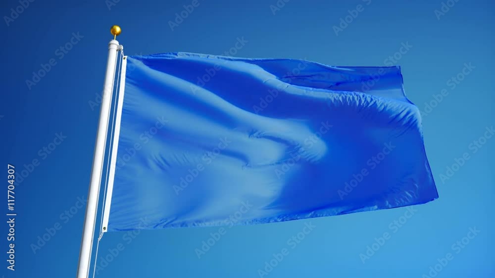 Light blue flag waving in slow motion against blue sky, seamlessly ...