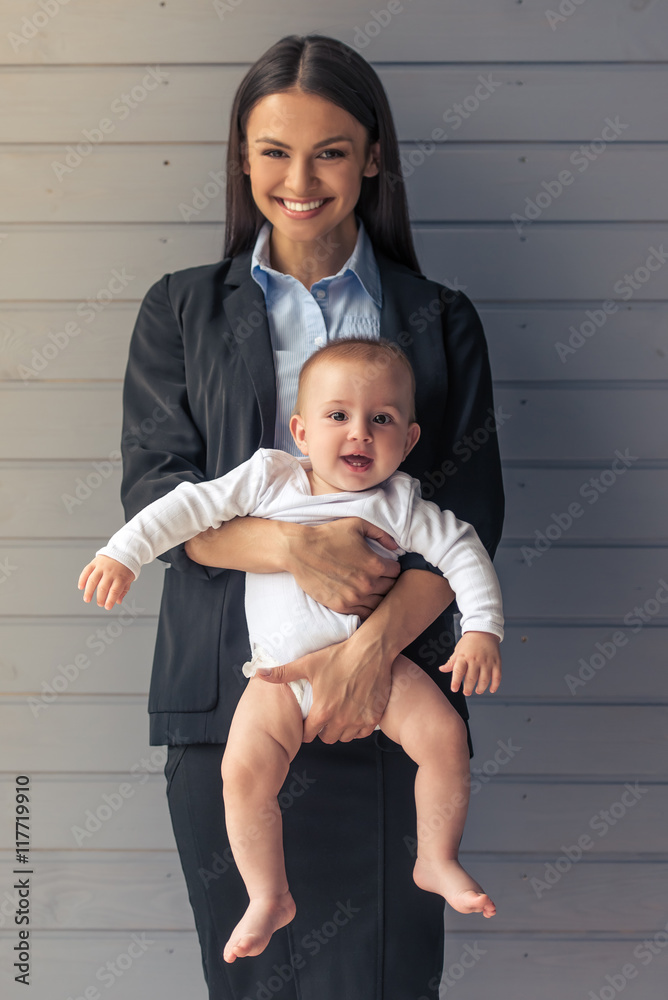 Fotografia do Stock: Business lady with her baby | Adobe Stock