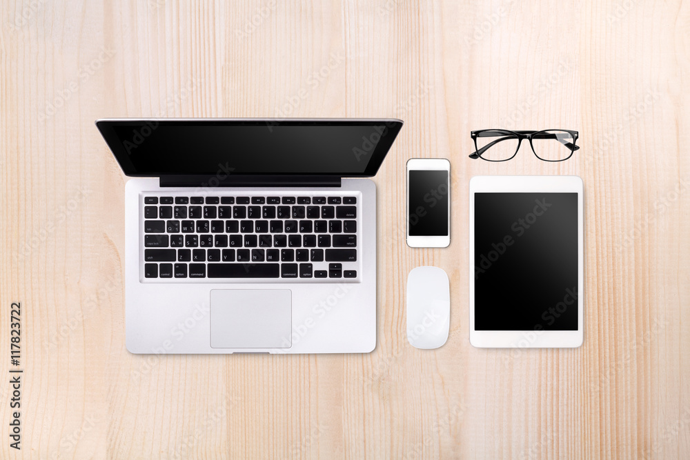 Laptop tablet and smartphone on wood table background with text Stock ...