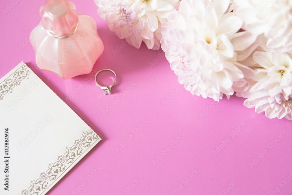 Paper for notes, perfume, ring, chrysanthemum on pink background Stock ...